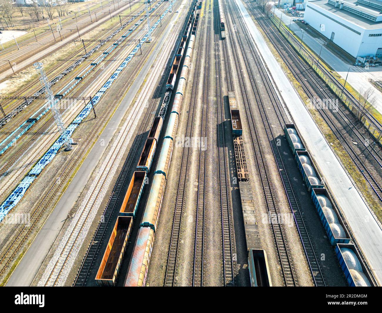 Cargo trains close-up. Aerial view of colorful freight trains on the ...