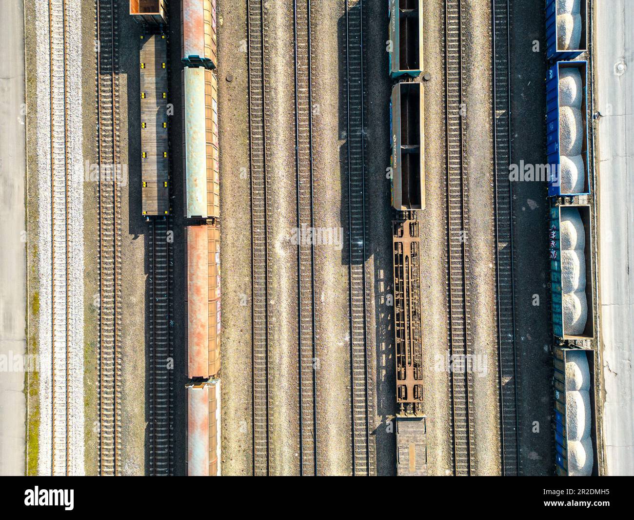 Cargo trains close-up. Aerial view of colorful freight trains on the ...