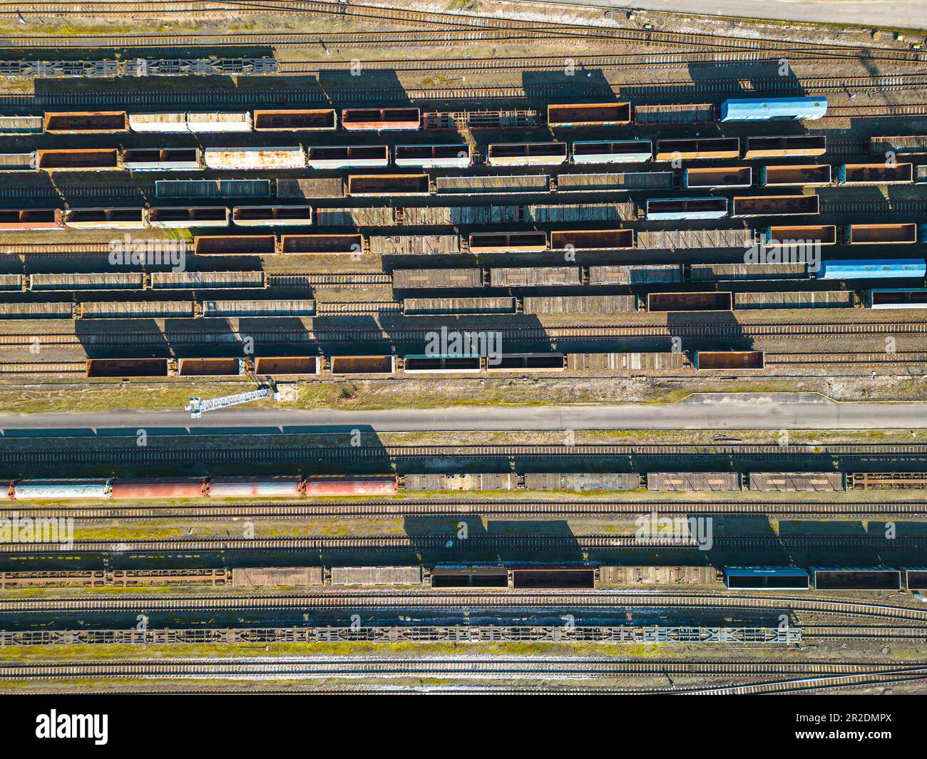 Cargo trains close-up. Aerial view of colorful freight trains on the ...