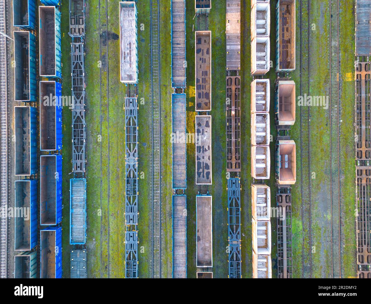 Cargo trains close-up. Aerial view of colorful freight trains on the ...