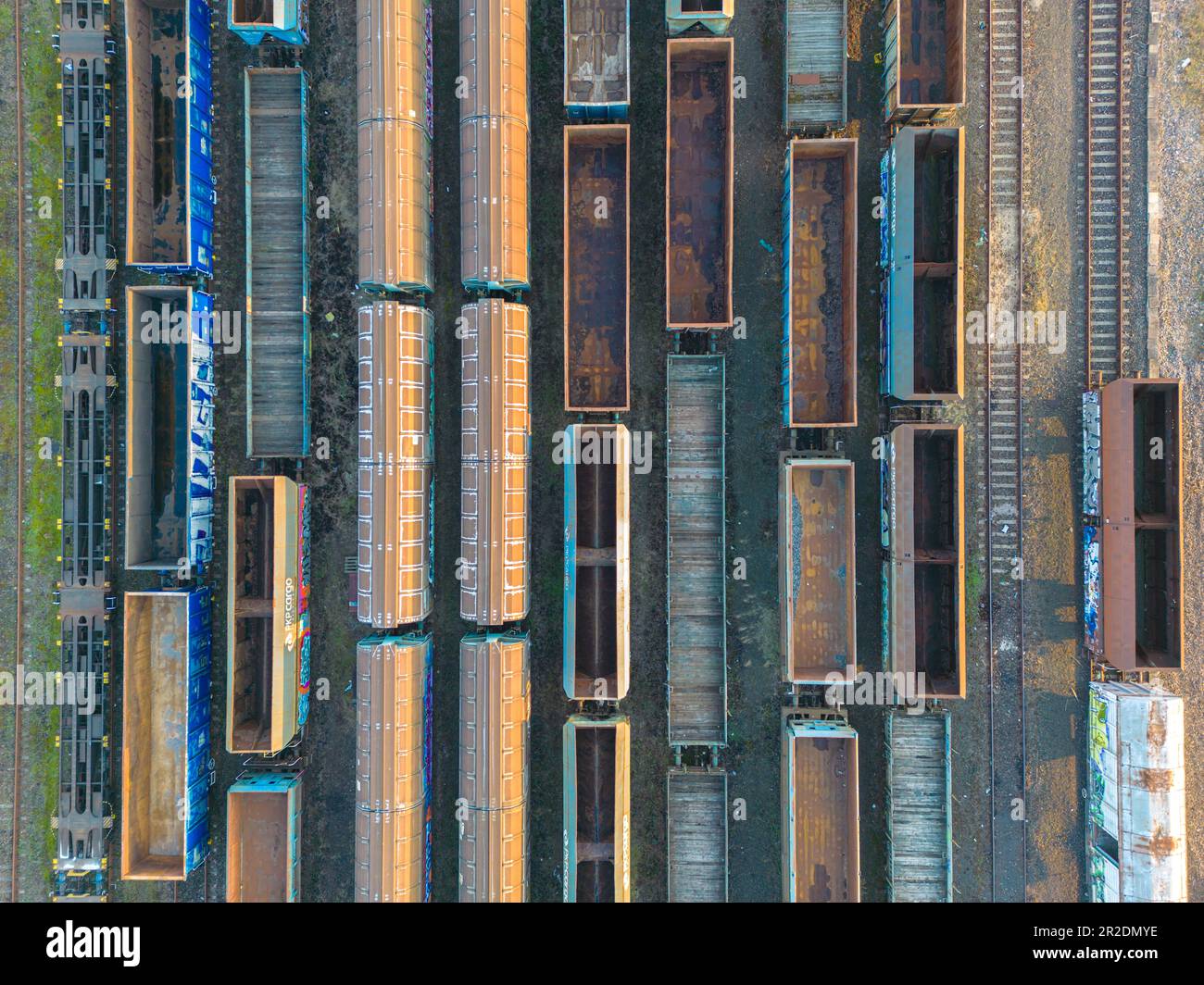 Cargo trains close-up. Aerial view of colorful freight trains on the ...