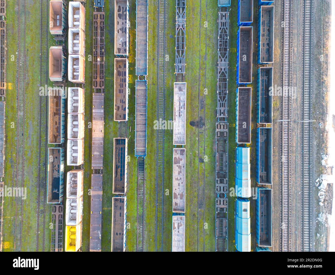 Cargo trains close-up. Aerial view of colorful freight trains on the ...