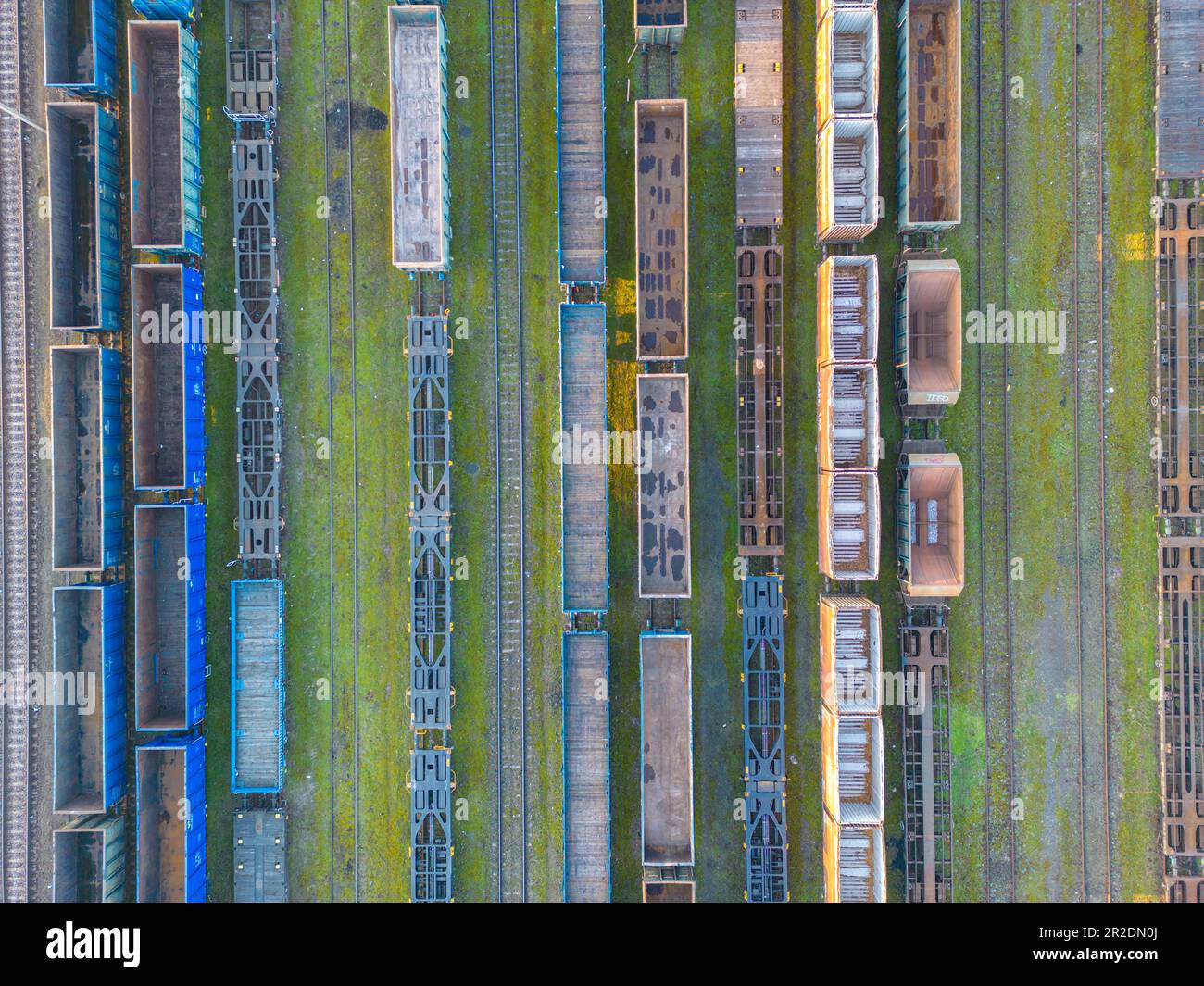 Cargo trains close-up. Aerial view of colorful freight trains on the ...