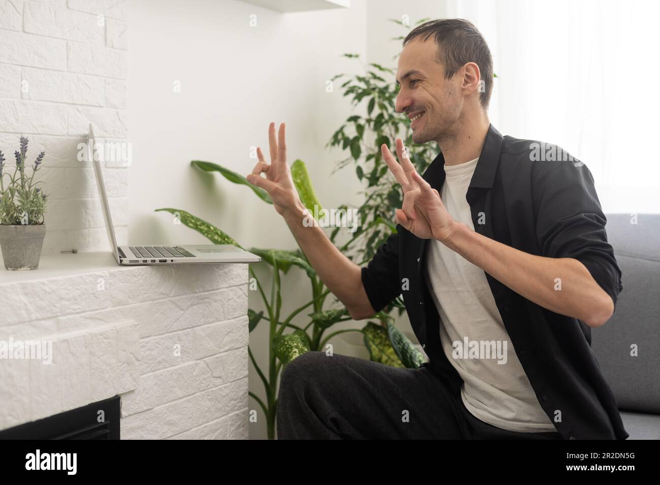 Adult Learning Sign Language For Deaf Disabled Stock Photo - Alamy
