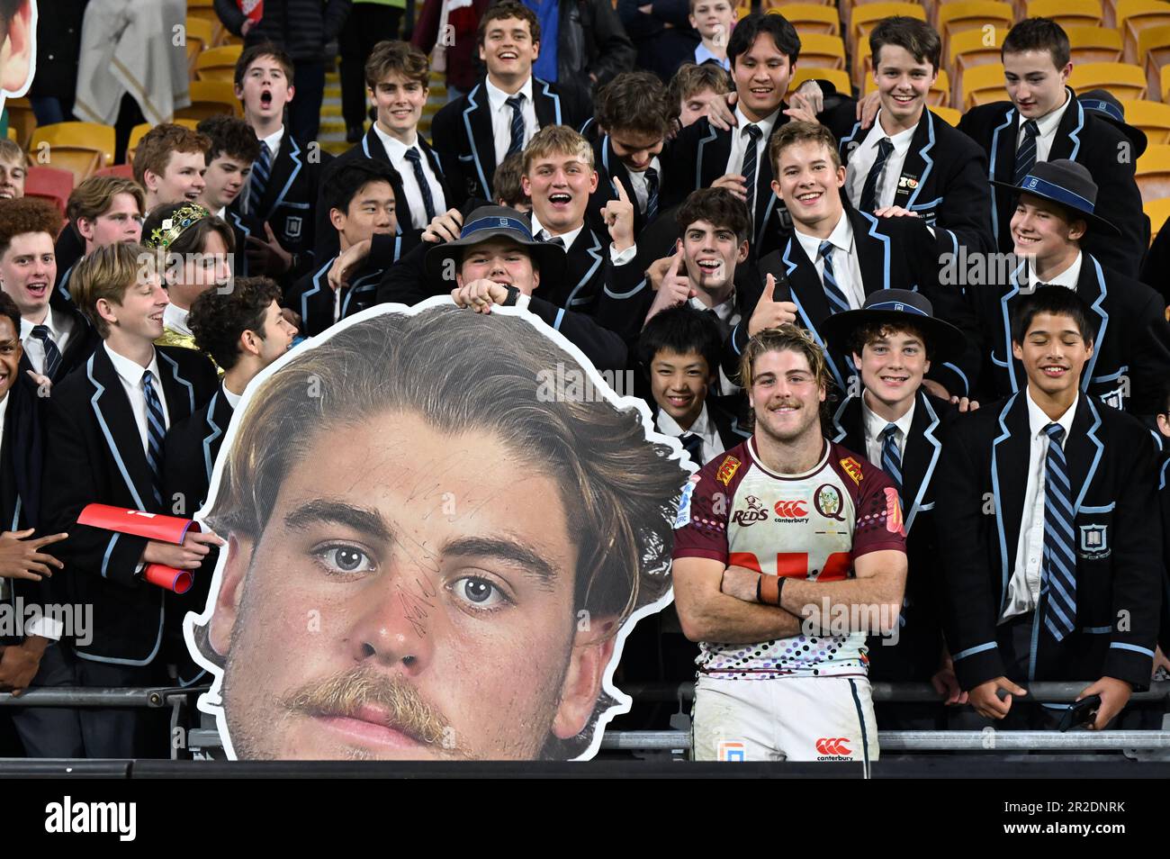 Fraser McReight of the Reds poses for a photo with students from his ...