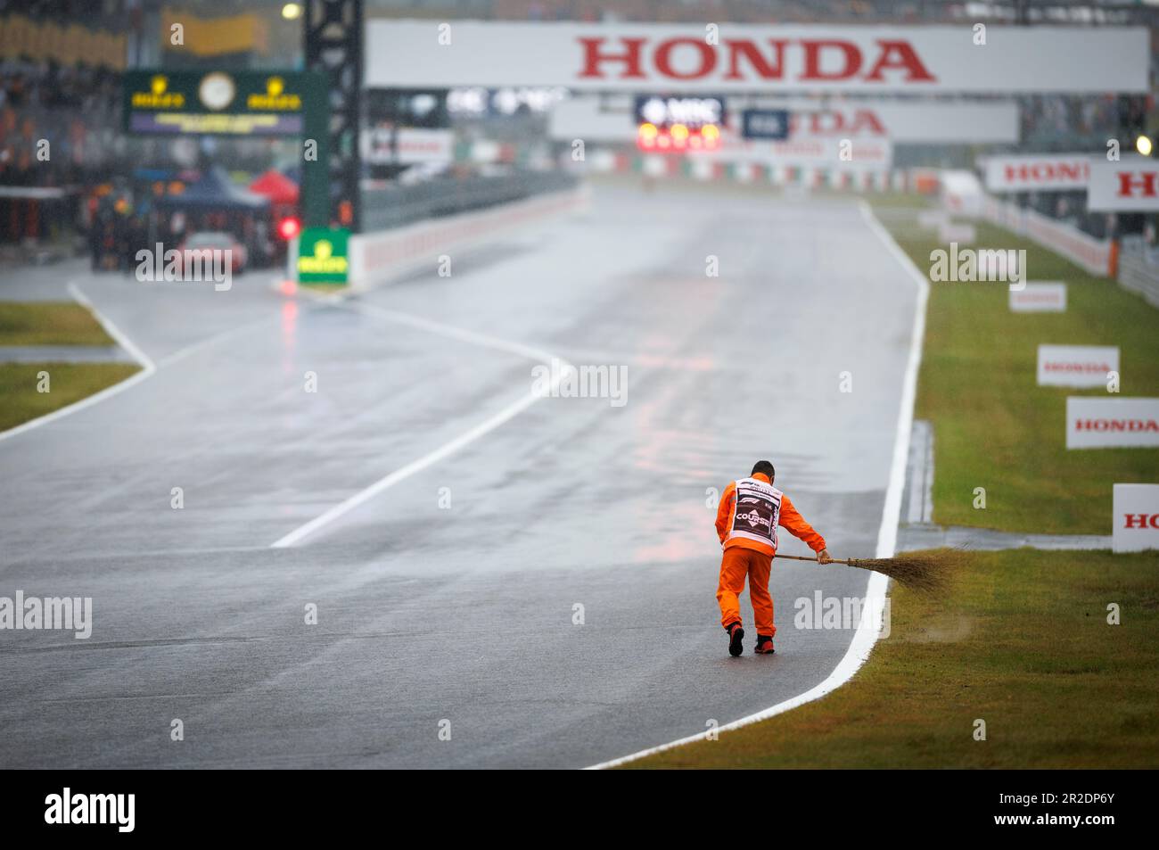 SUZUKA, JAPAN, Suzuka Circuit, 9. October: Track saftey marshals clean ...