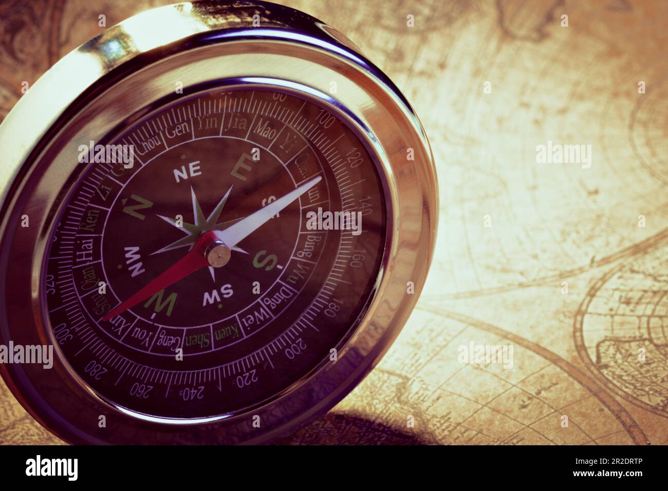 Old compass on vintage map Stock Photo - Alamy