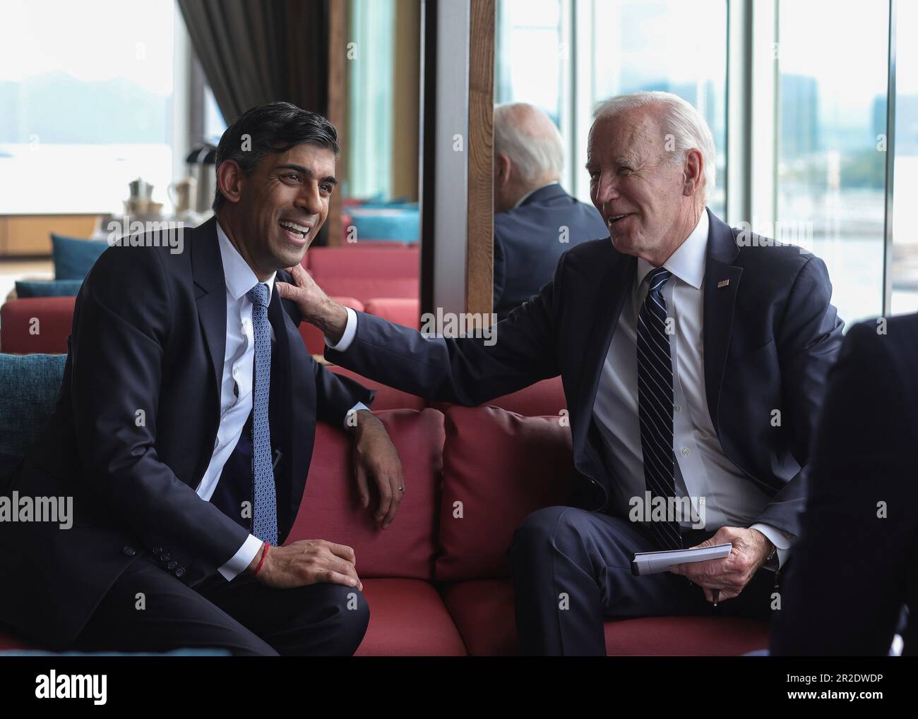 Britain's Prime Minister Rishi Sunak (L) talks with US President Joe ...