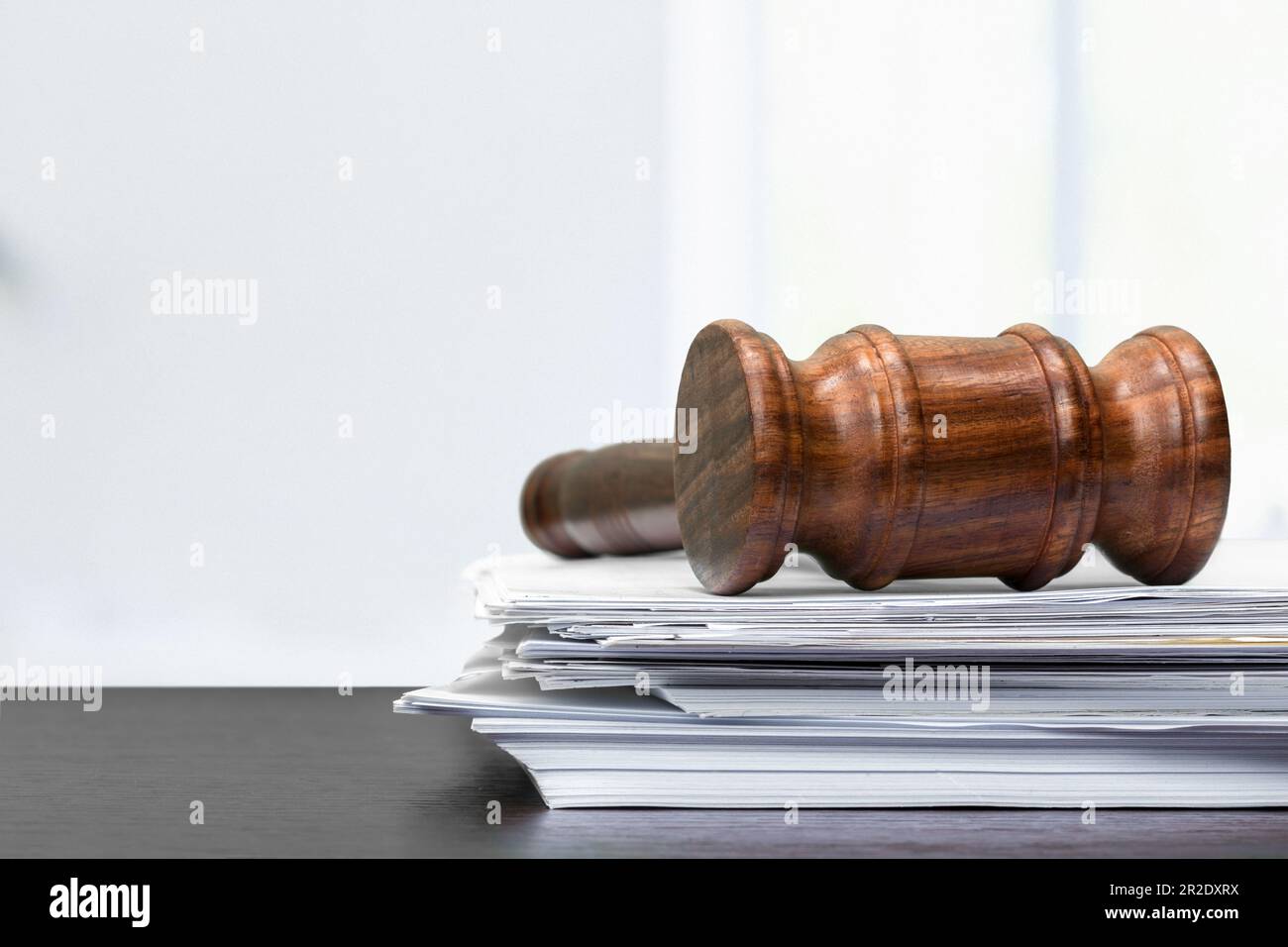 judge hammer on white paper and table Stock Photo - Alamy