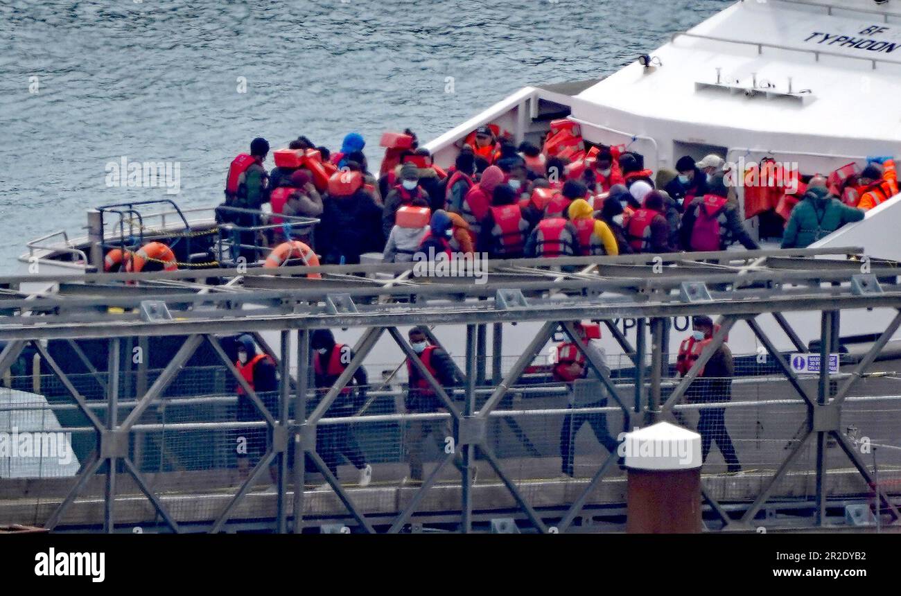 A group of people thought to be migrants are brought in to Dover, Kent ...