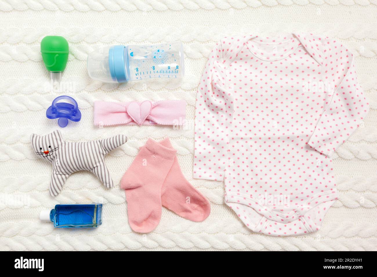 Set of clothing and items for a baby Stock Photo - Alamy