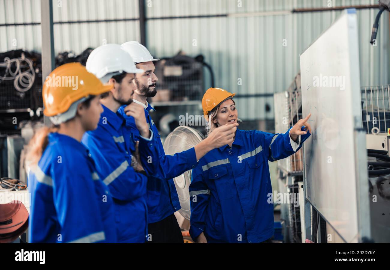 A group of robotic engineers collaboratively brainstorms and discusses ...