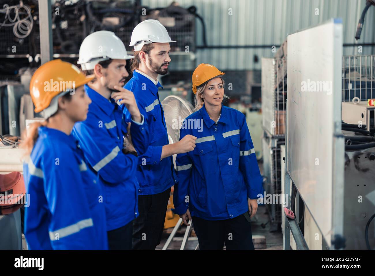 A group of robotic engineers collaboratively brainstorms and discusses ...