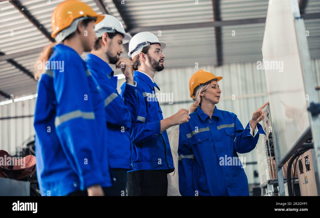 A group of robotic engineers collaboratively brainstorms and discusses ...