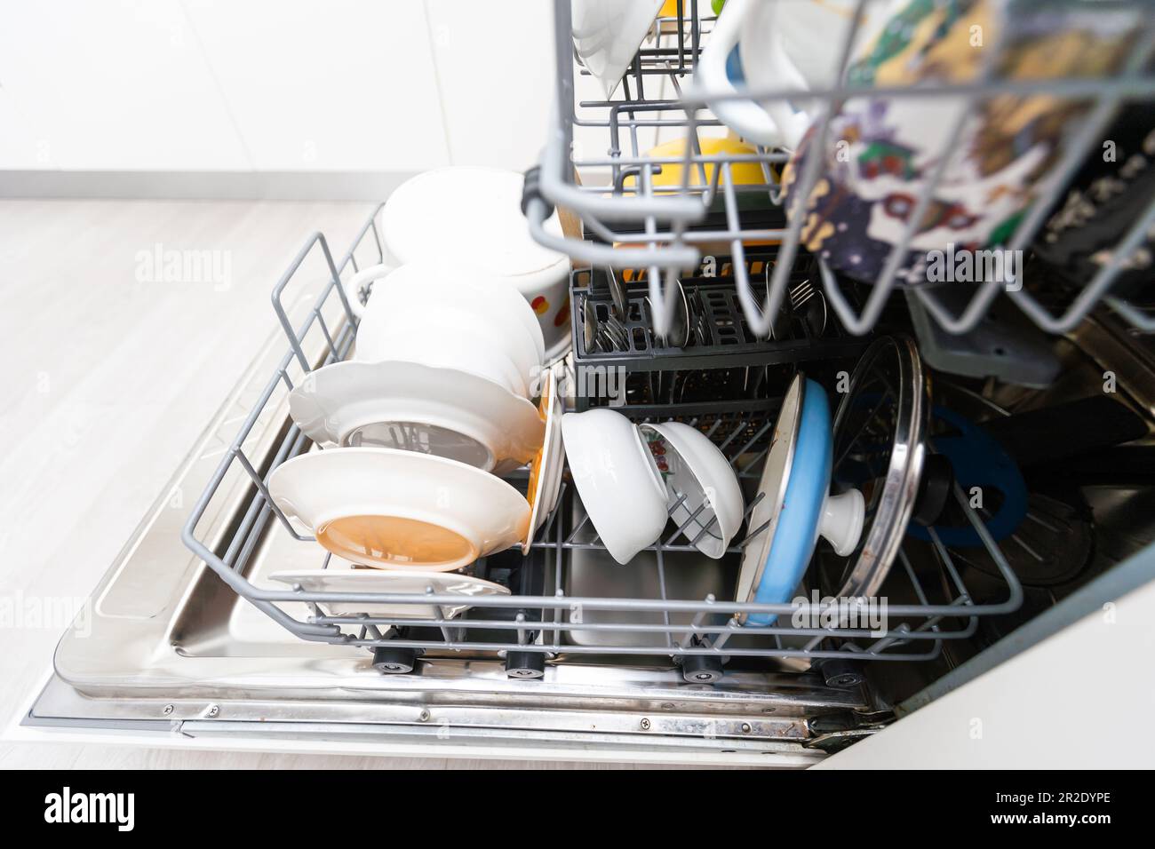 Open dishwasher with clean dishes in the white kitchen Stock Photo - Alamy