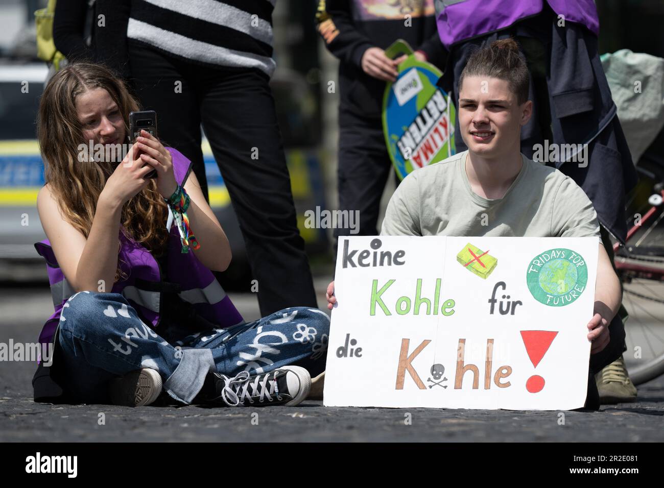 Dresden, Germany. 19th May, 2023. Holding a homemade placard reading "No coal for coal ...