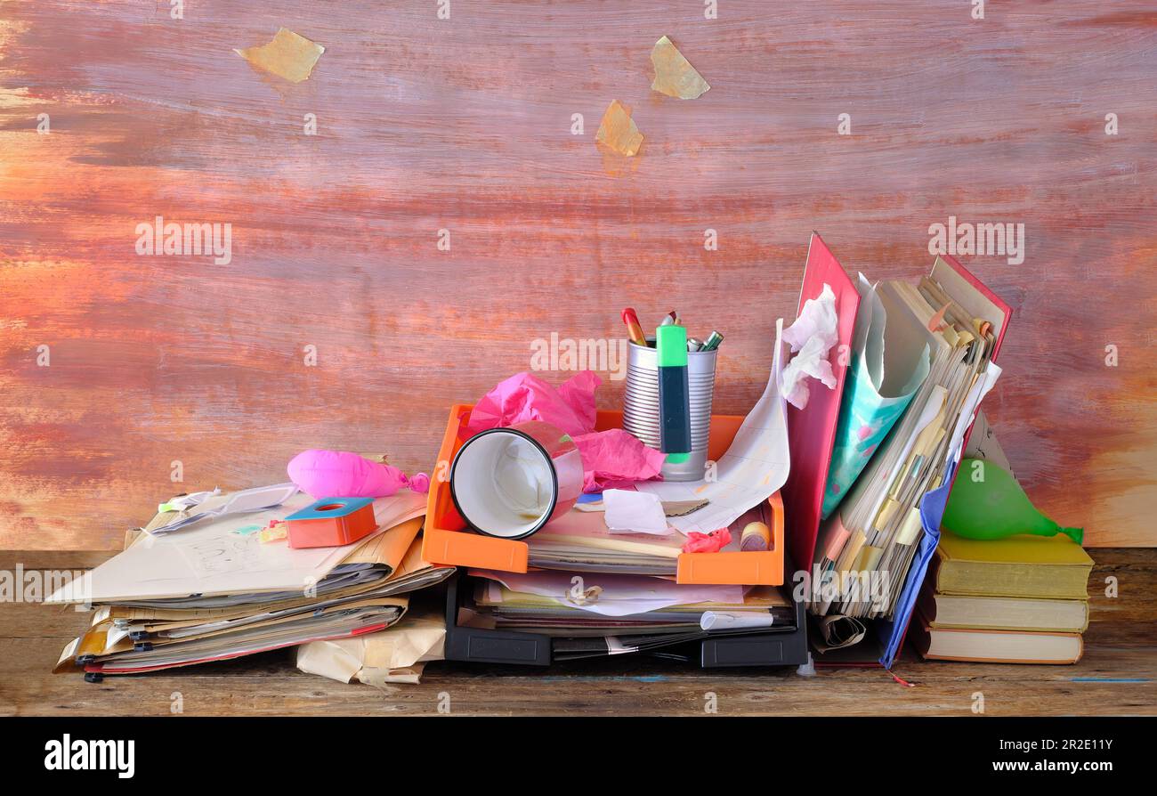 Messy workplace,chaotic office, overworked concept with grungy desk ...