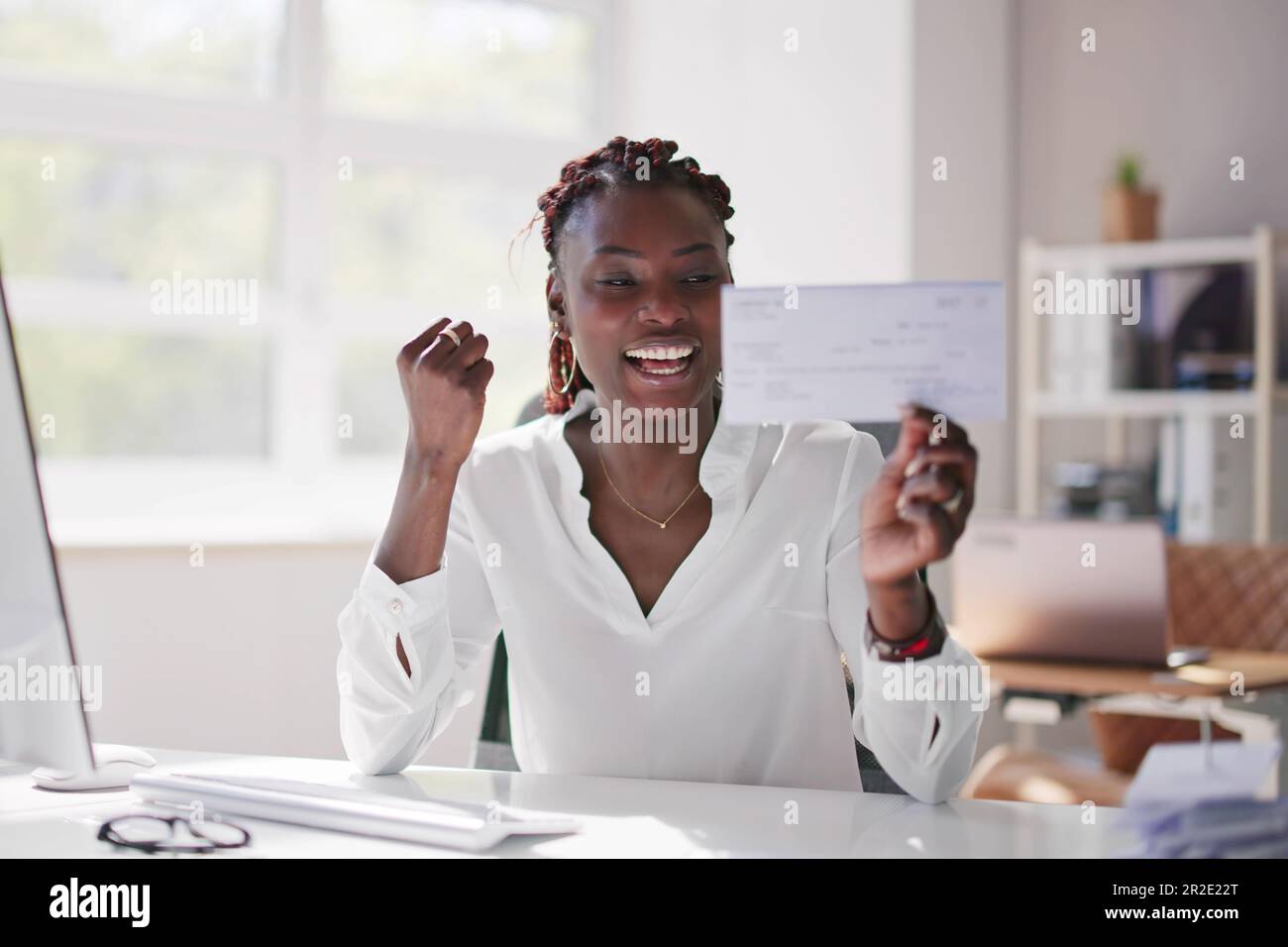 Holding Paycheck Or Payroll Check Or Insurance Cheque In Hand Stock ...
