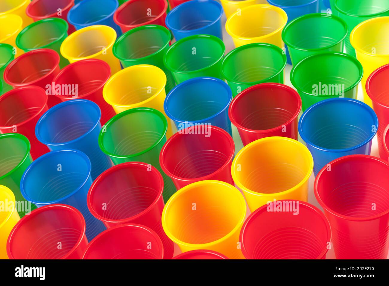 Multicolor plastic glasses isolated on white background Stock Photo - Alamy