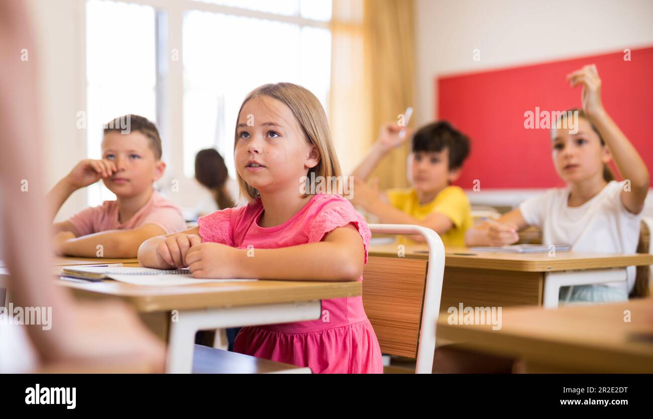 Children raising hands Stock Photo - Alamy