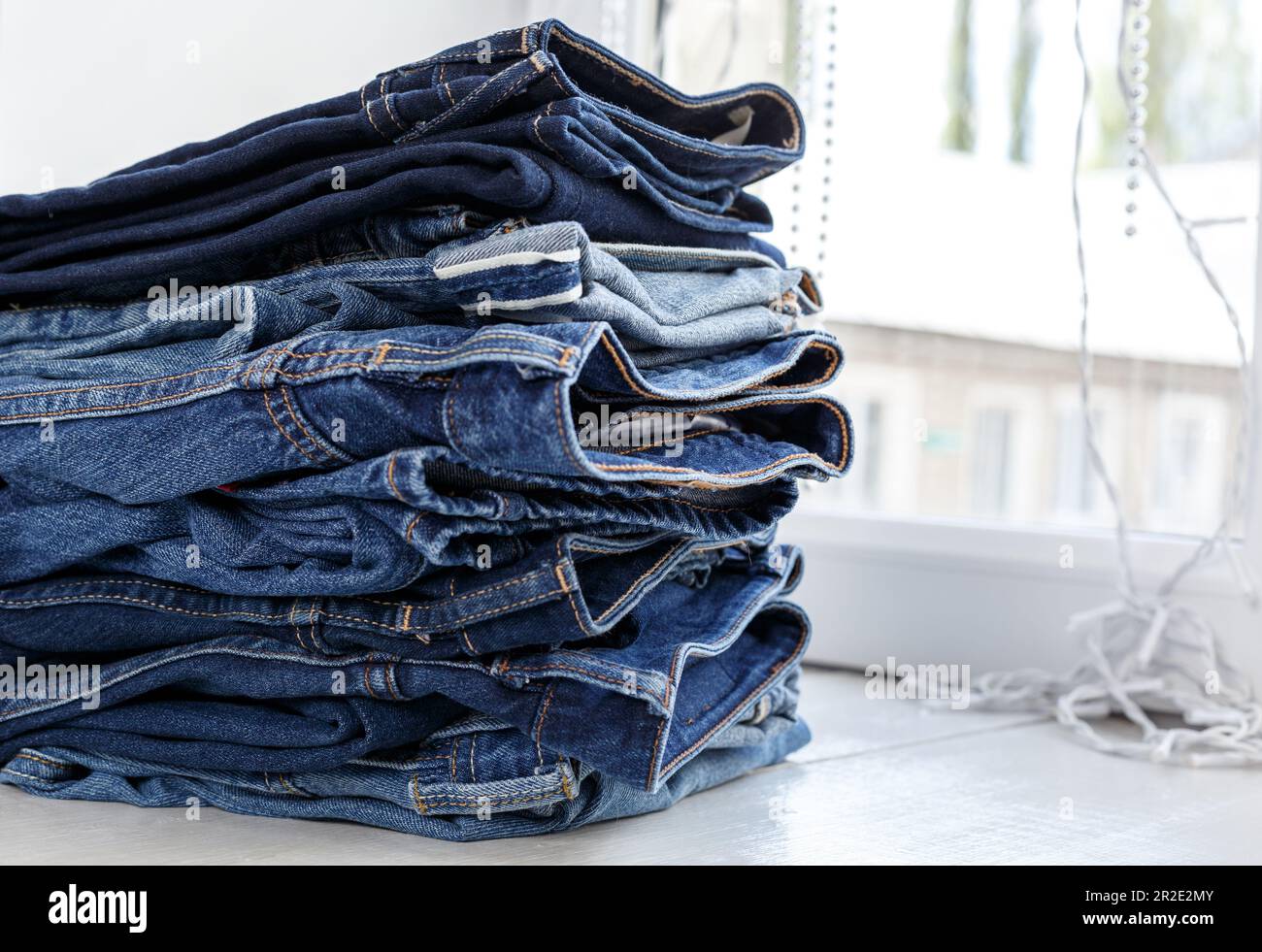 Pile of jeans Stock Photo - Alamy
