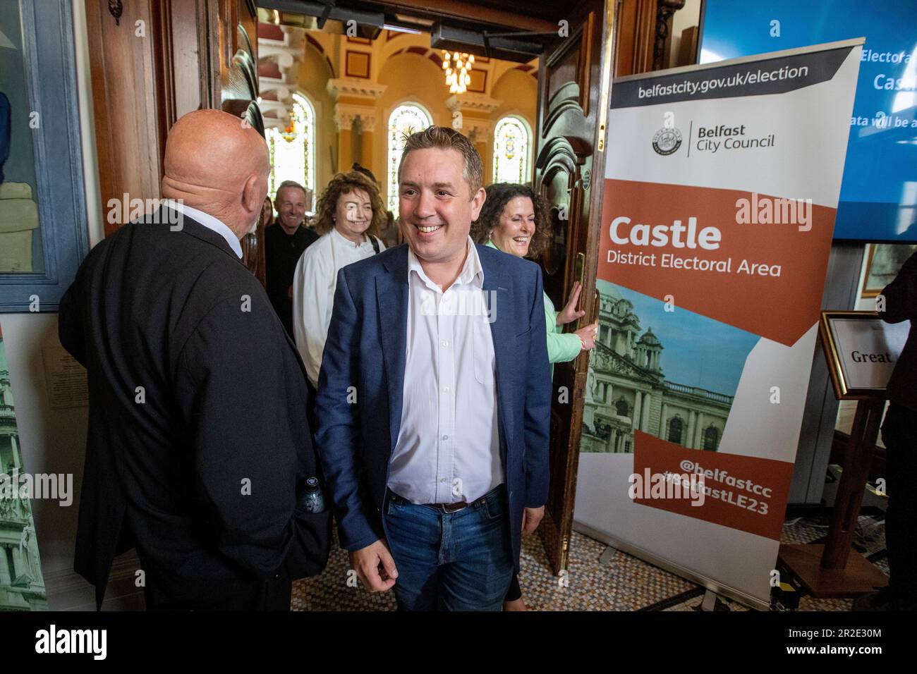 Sinn Fein candidates Conor Maskey (centre) and Bronach Anglin (right ...