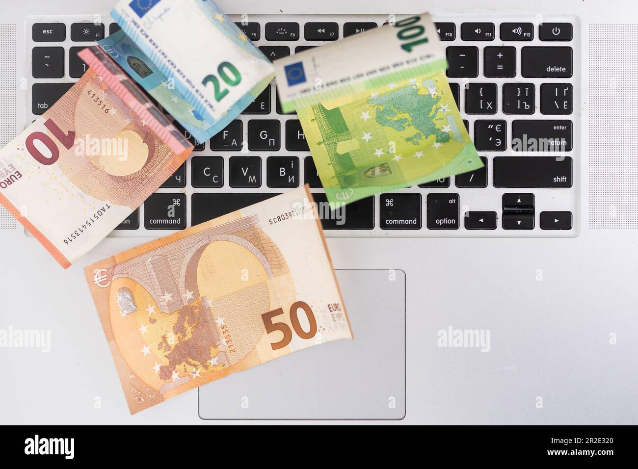 100 dollar bills on keyboard hi-res stock photography and images - Alamy