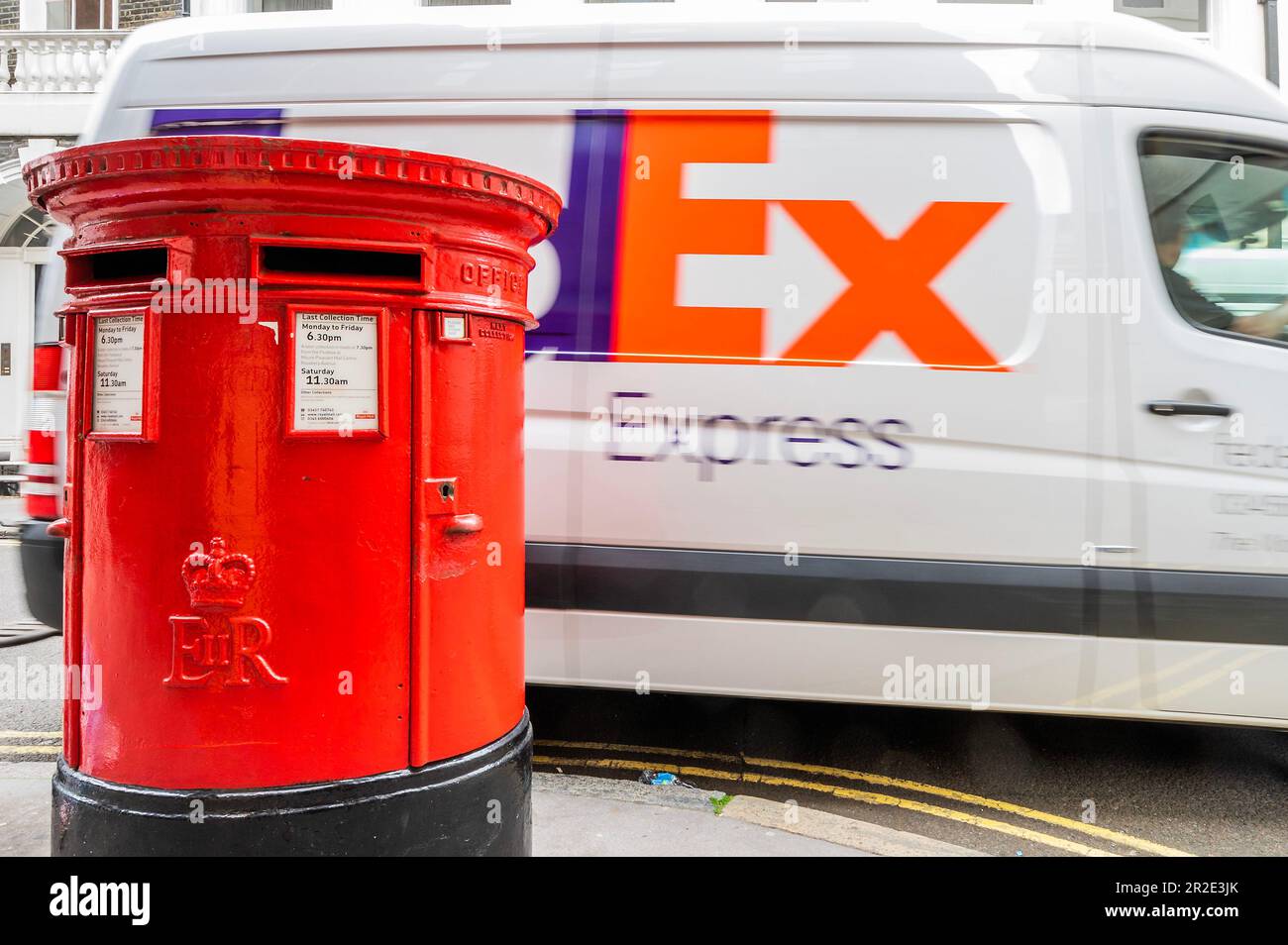 London, UK. 19th May, 2023. A competitors van (Fed Ex) passes a post ...