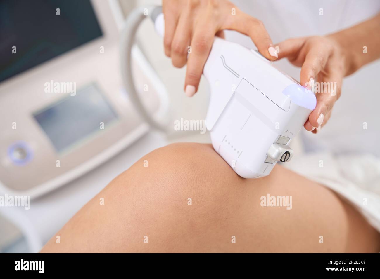 Staff of the aesthetic medicine clinic uses a modern apparatus Stock ...