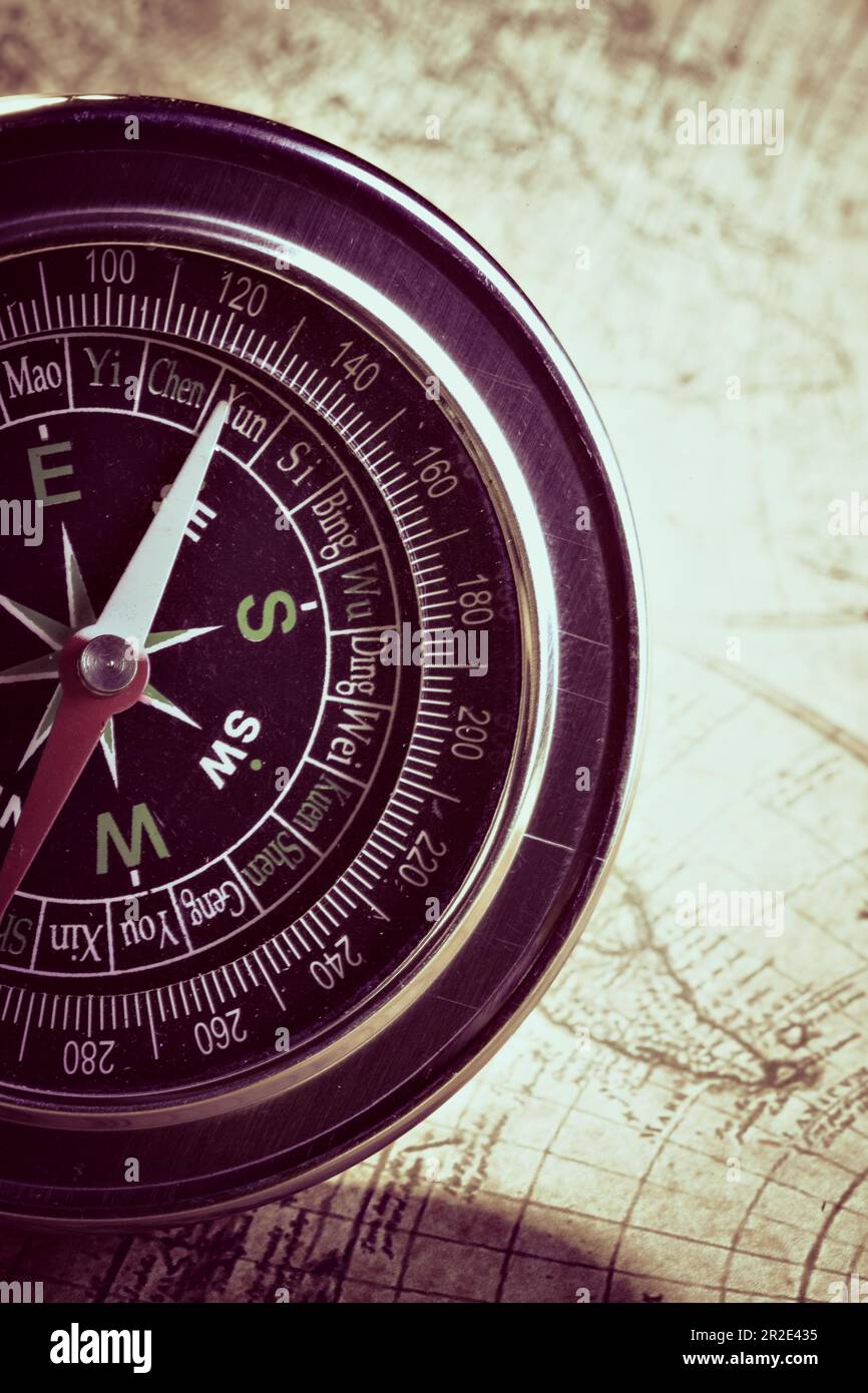 Old compass on vintage map Stock Photo - Alamy