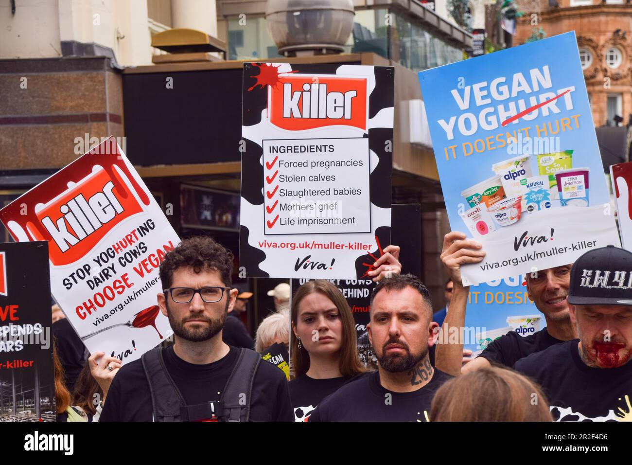 London, England, UK. 19th May, 2023. Protesters hold signs rebranding ...