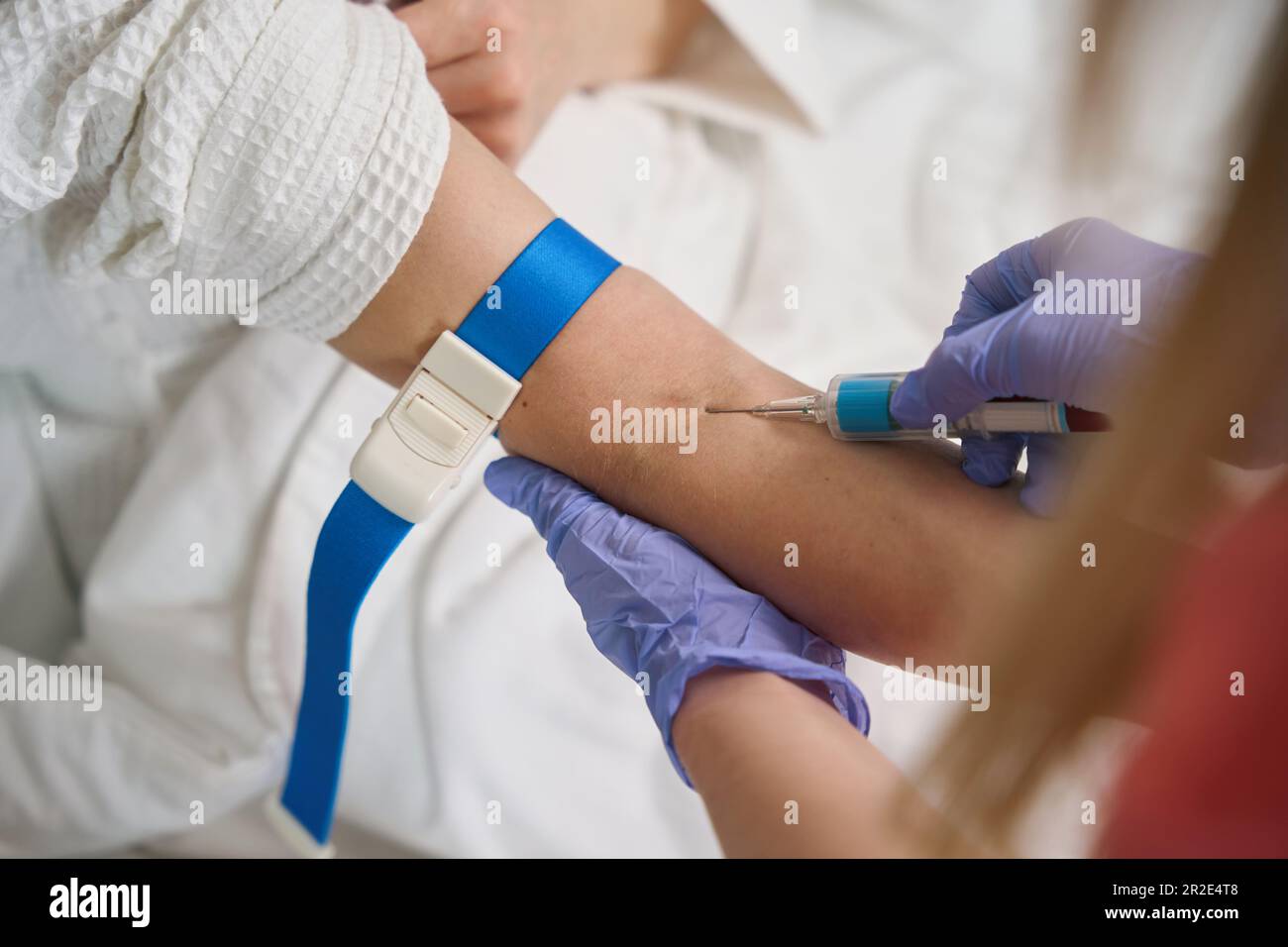 Doctor giving intramuscular injection in female arm Stock Photo - Alamy