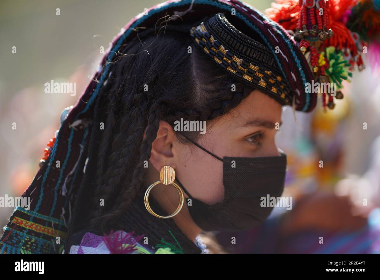 A Kalash woman dressed in traditional clothing at the Chilam Josh ...