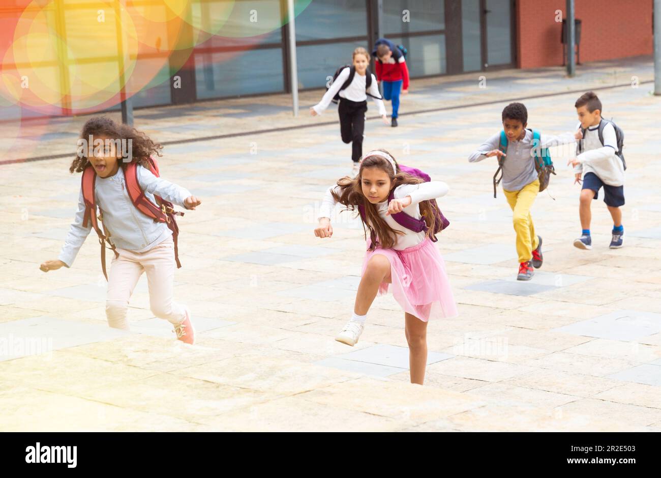 Happy schoolchildren running in the race from school outdoors Stock ...