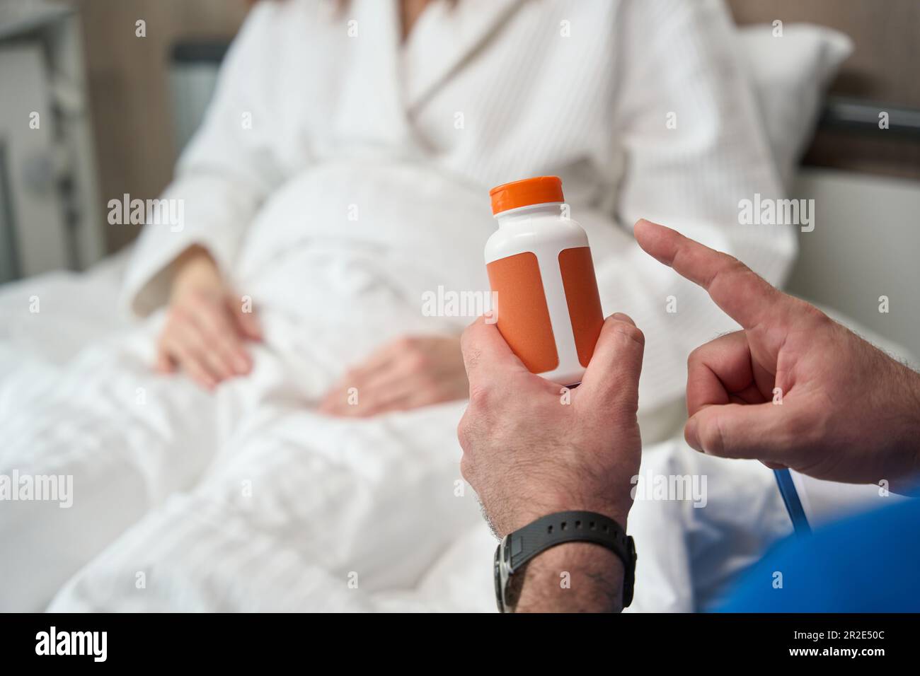 Female patient getting medication in hospital ward Stock Photo - Alamy