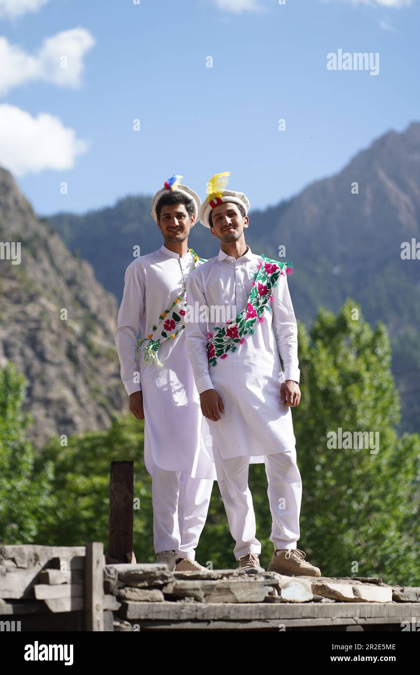 Bamburet, KPK,Pakistan - 05152023: Two Kalash men at the Chilam Joshi ...
