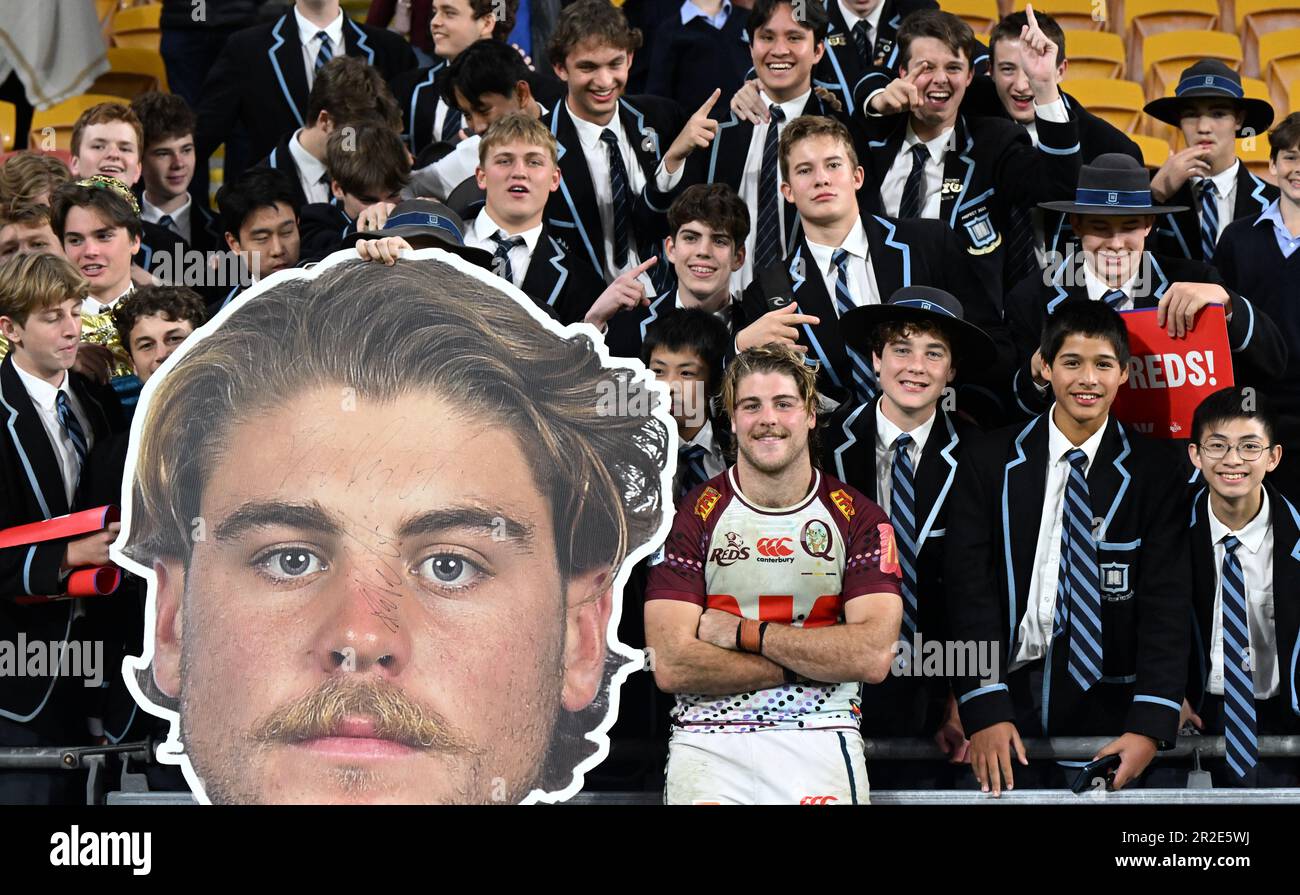 Fraser McReight of the Reds poses for a photo with students from his ...