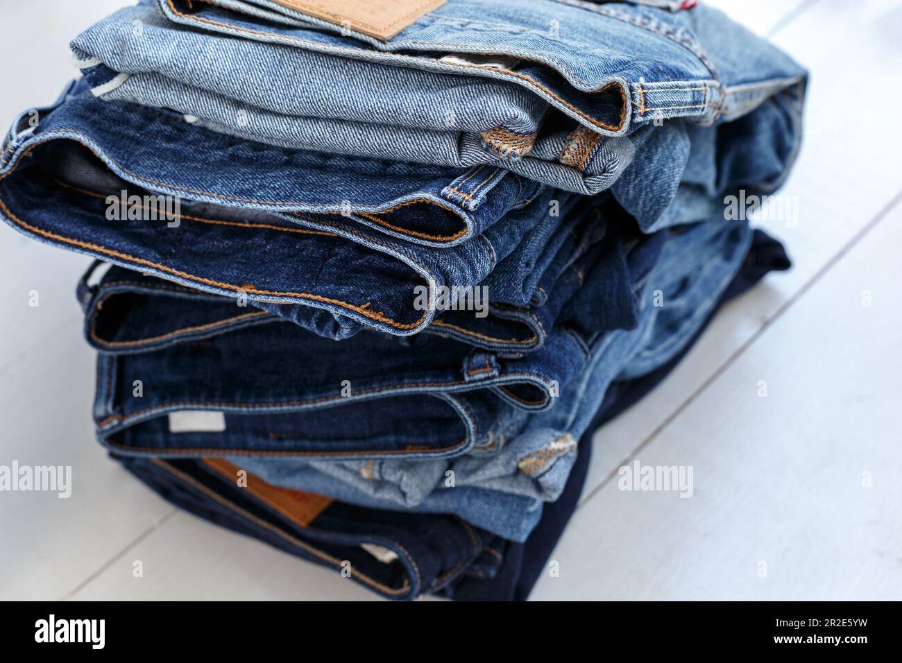Pile of jeans Stock Photo - Alamy