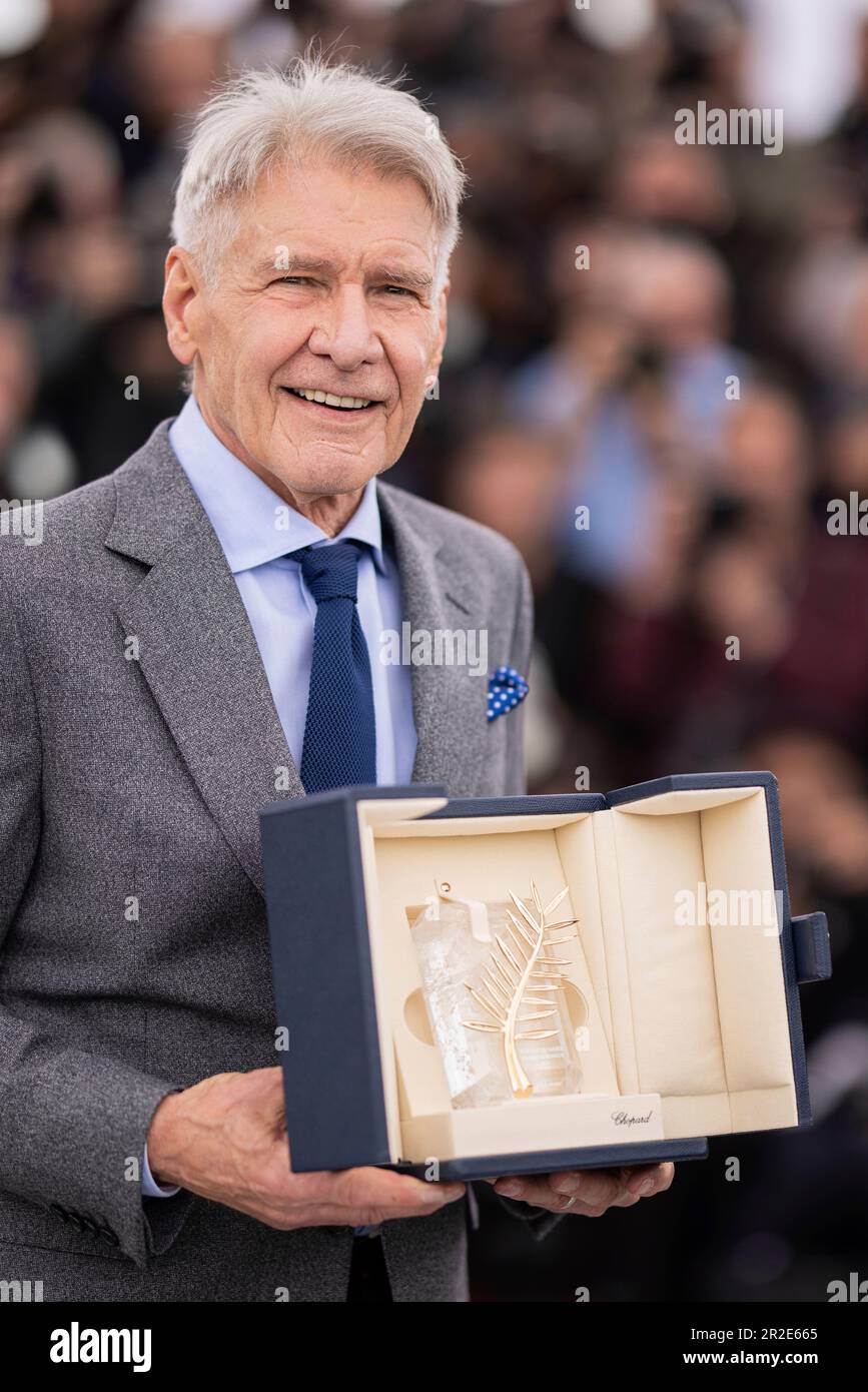 Harrison Ford poses for photographers with his honorary Palme d'Or at the photo call for the ...