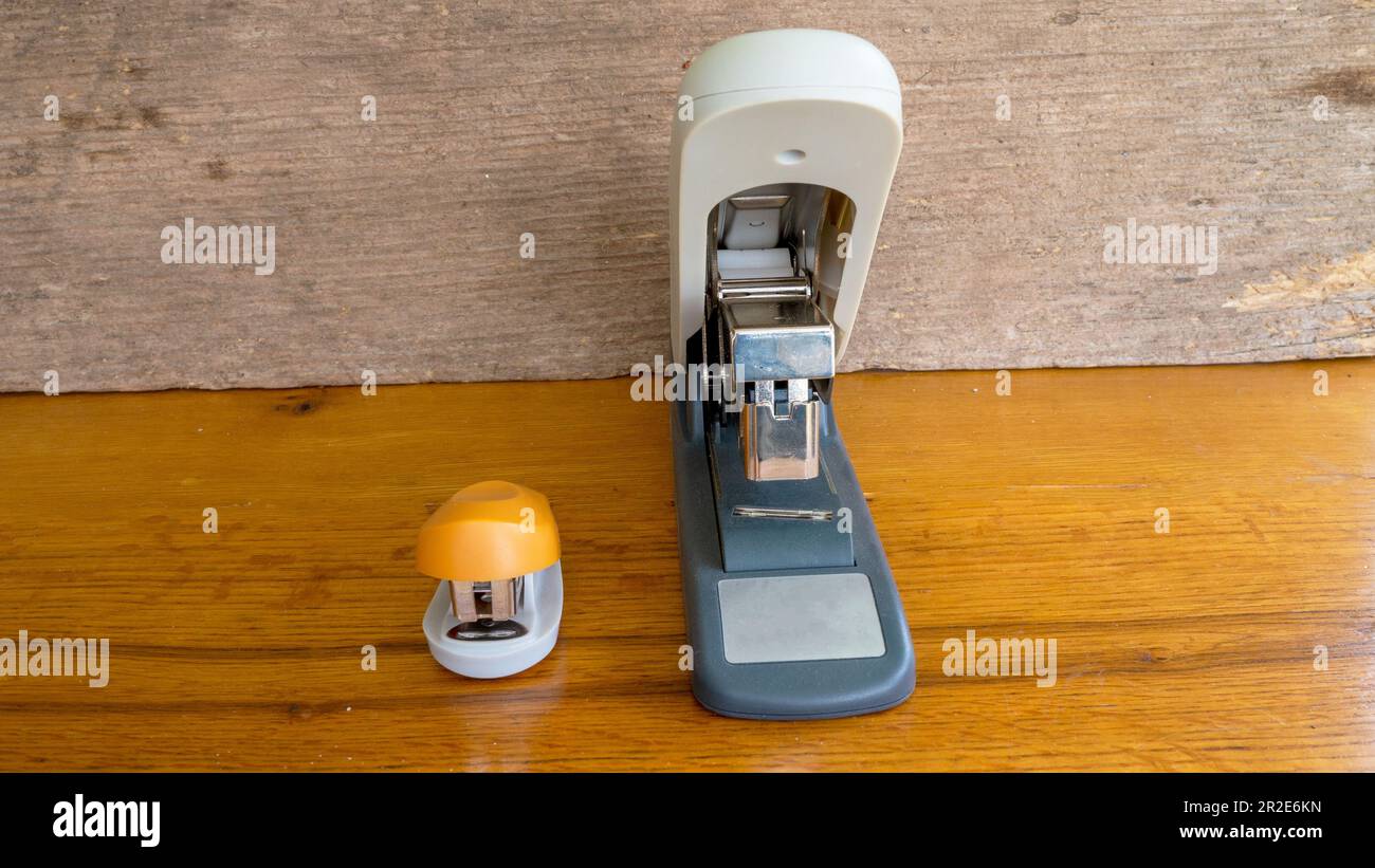 A Large and a Small Office Stapler Stock Photo - Alamy