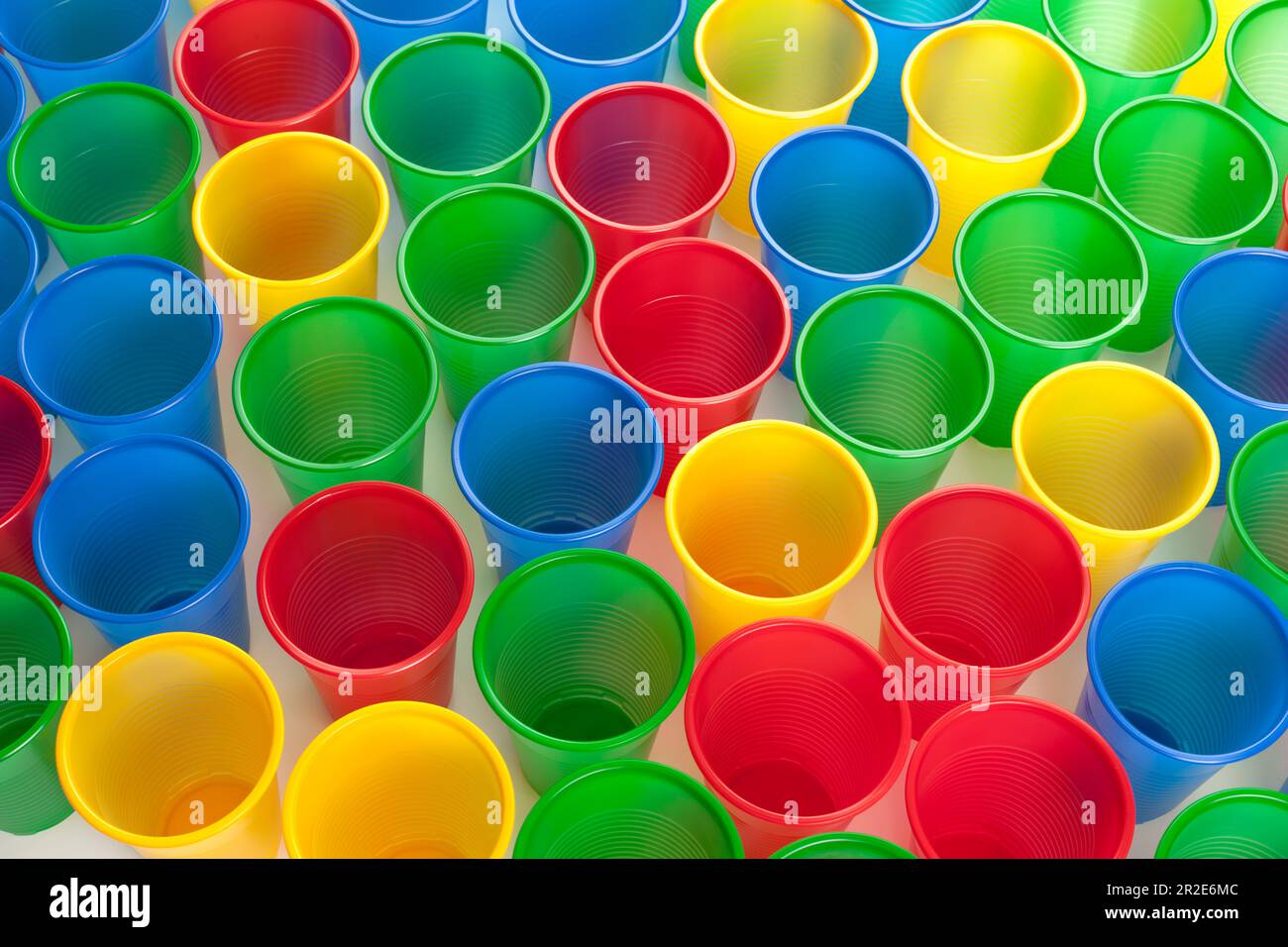Multicolor plastic glasses isolated on white background Stock Photo - Alamy
