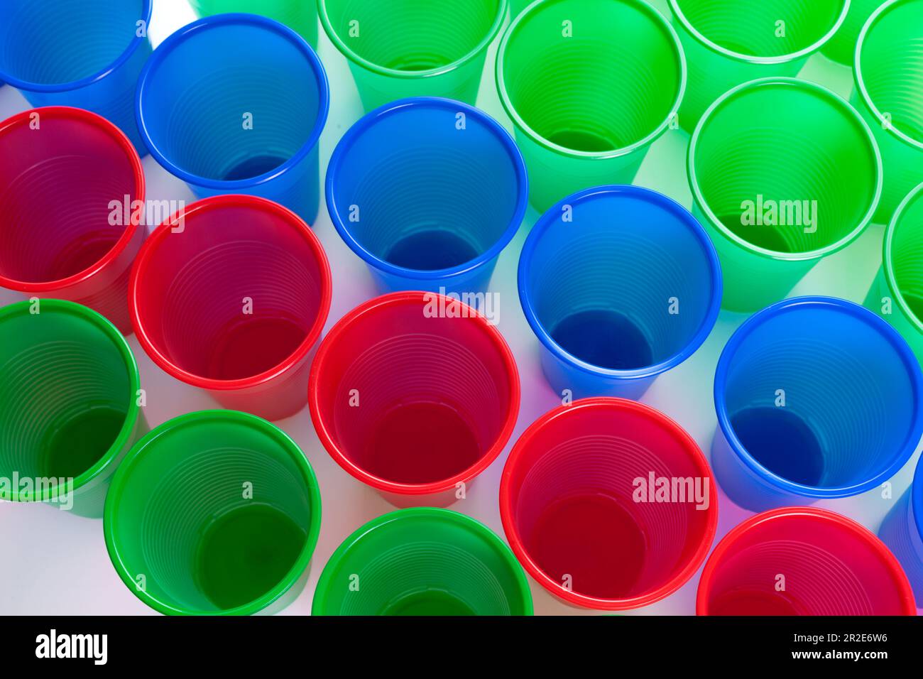 Multicolor plastic glasses isolated on white background Stock Photo - Alamy