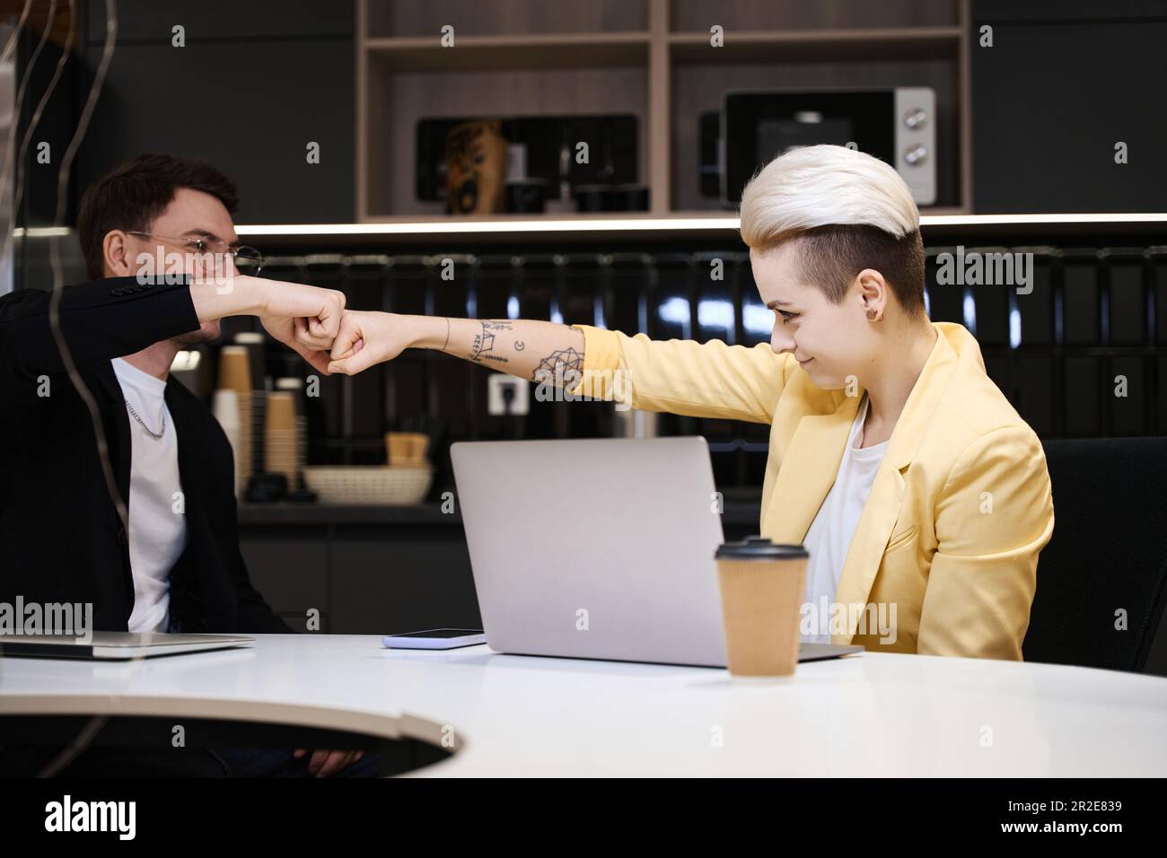 Partners doing fist bump finishing project in the office Stock Photo ...