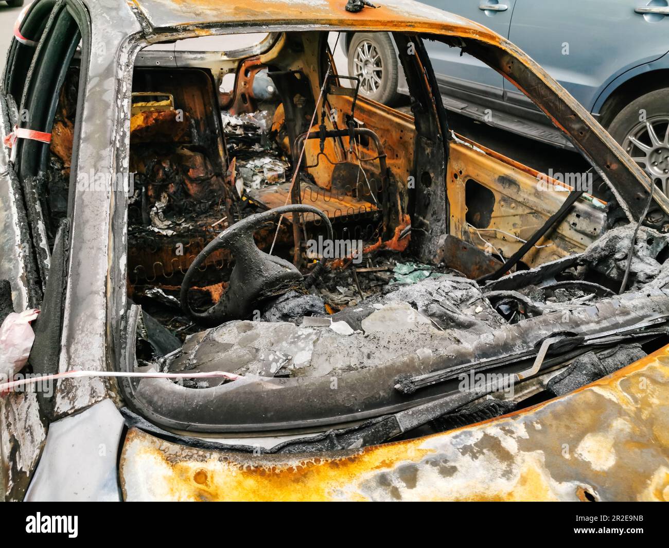 Broken and burned cars in the parking lot, accident or deliberate ...