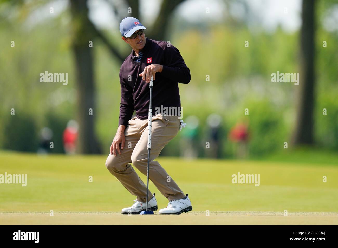Adam Scott, of Australia, reacts after missing a putt on the 17th hole ...