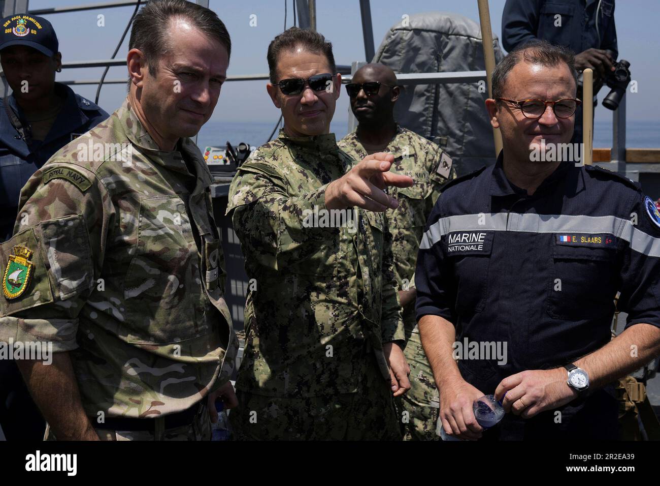 From left, Commodore Philip Dennis, commander of the United Kingdom ...