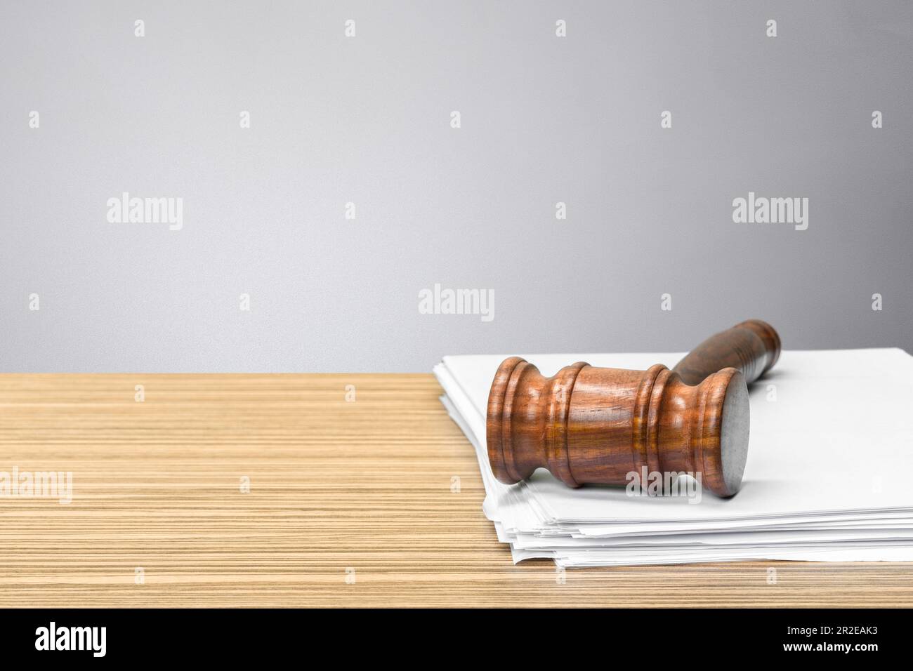 judge hammer on white paper and table Stock Photo - Alamy