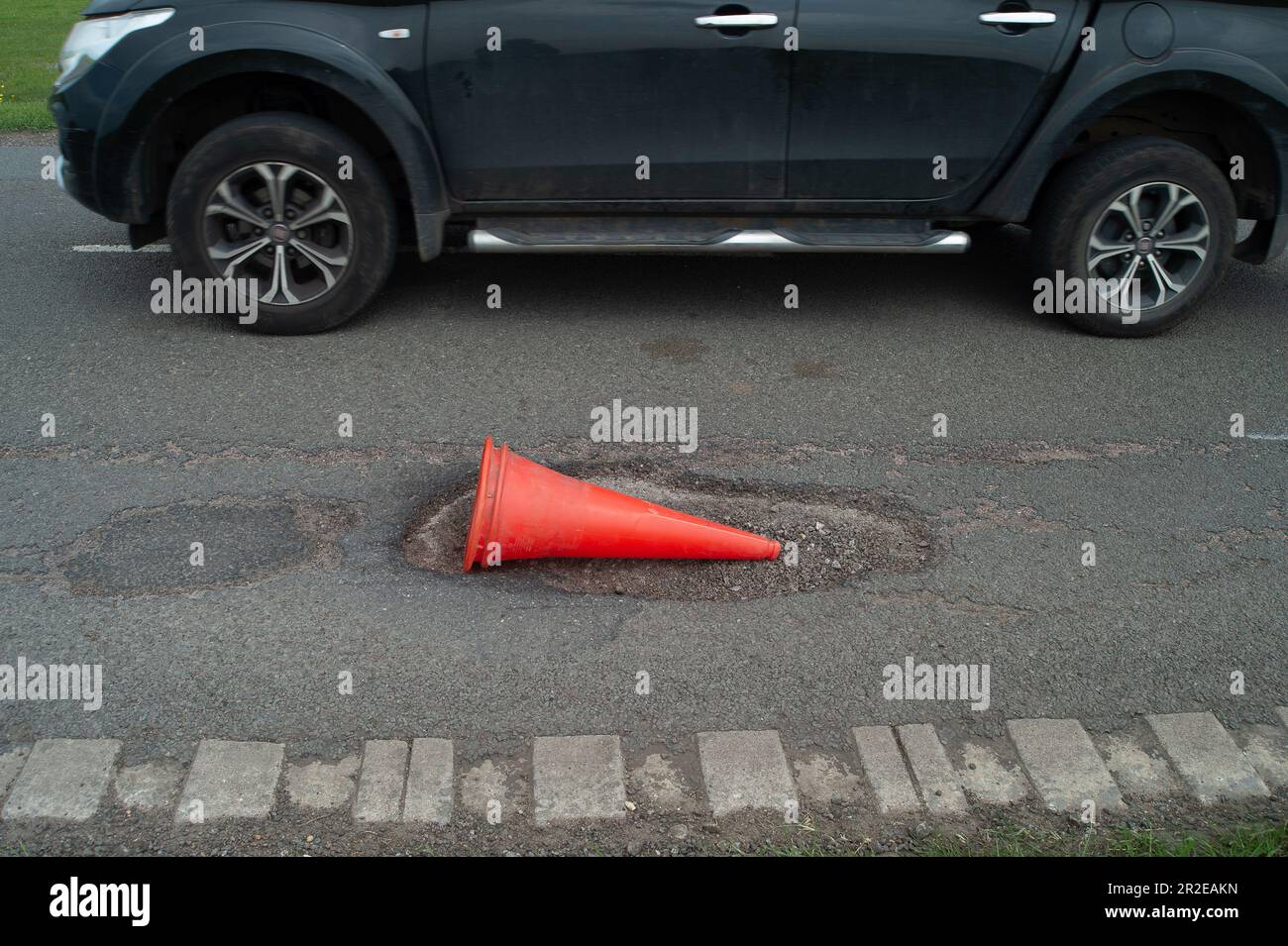 Cars over potholes hi-res stock photography and images - Alamy