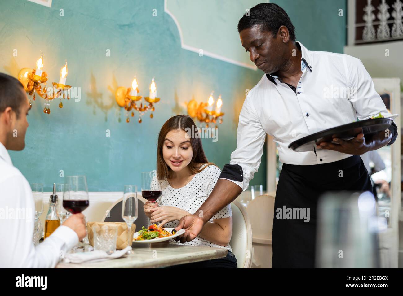 Couple offering food meal restaurant hi-res stock photography and ...