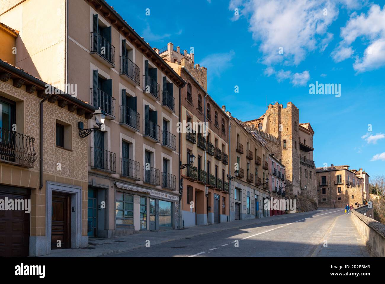 Beautiful streets of medieval city of Segovia. People walking. Sunset ...